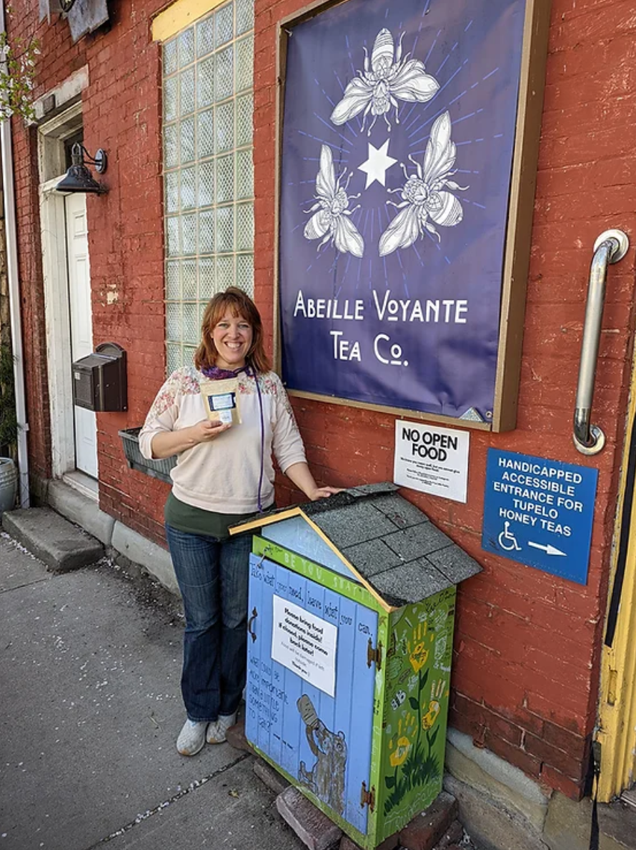 owner Danielle Spinola in front of tea shop
